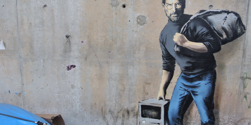 Banksy uses Steve Jobs as an example of Syrian immigration at a refugee ...